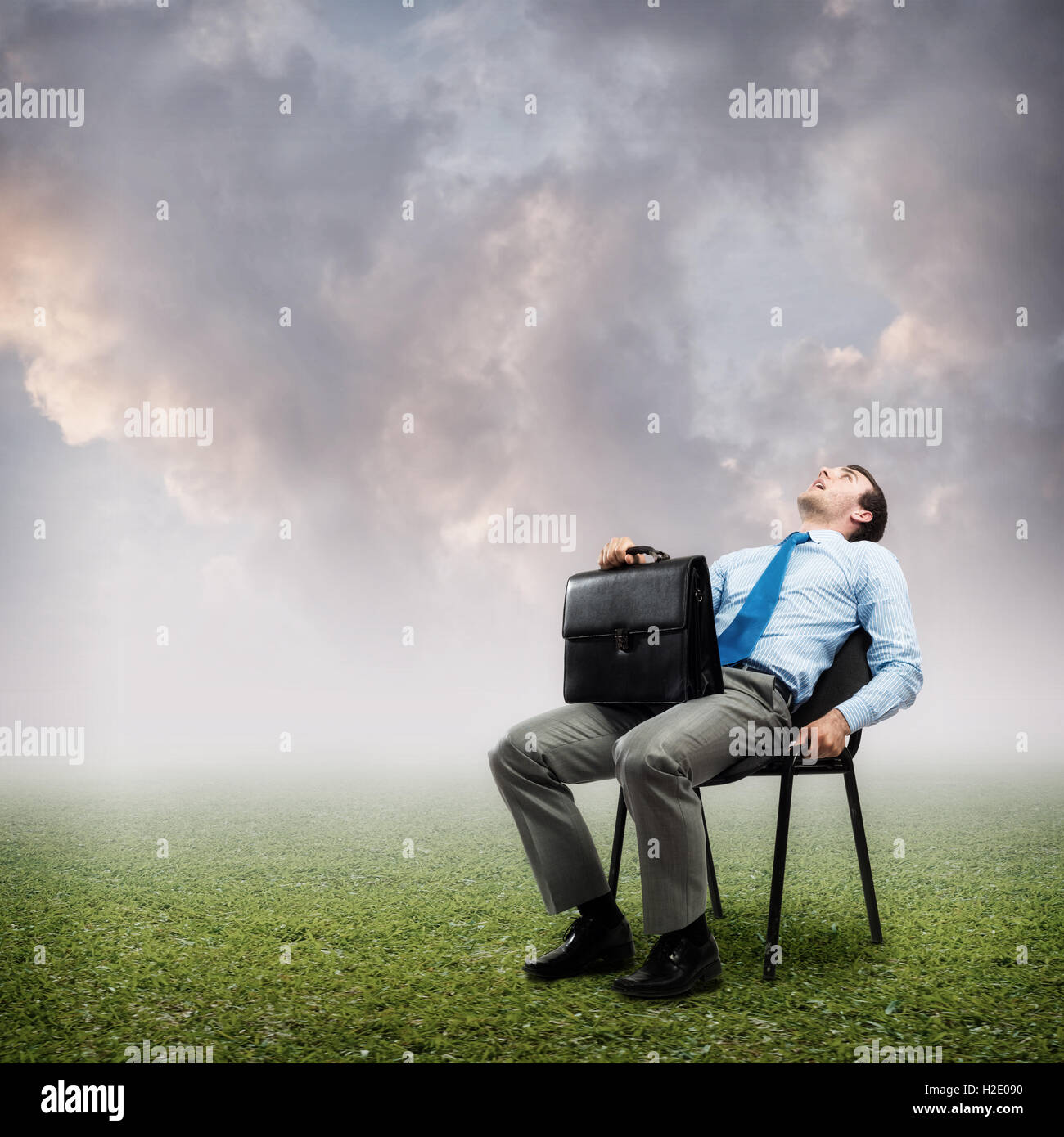 Young business man looking up Stock Photo - Alamy