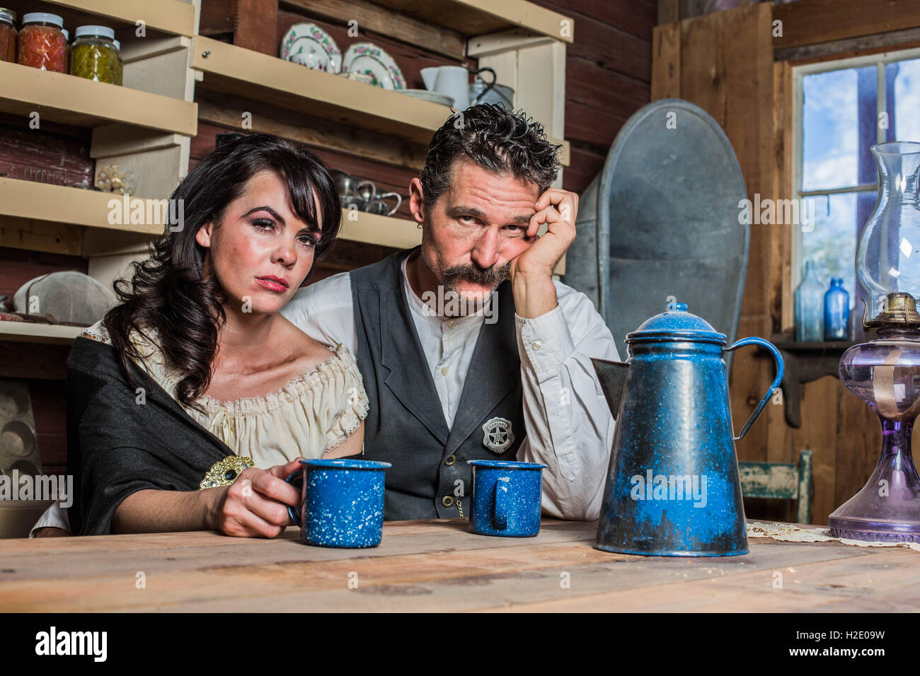 Sad Western Sheriff and Woman Pose Inside House Stock Photo - Alamy