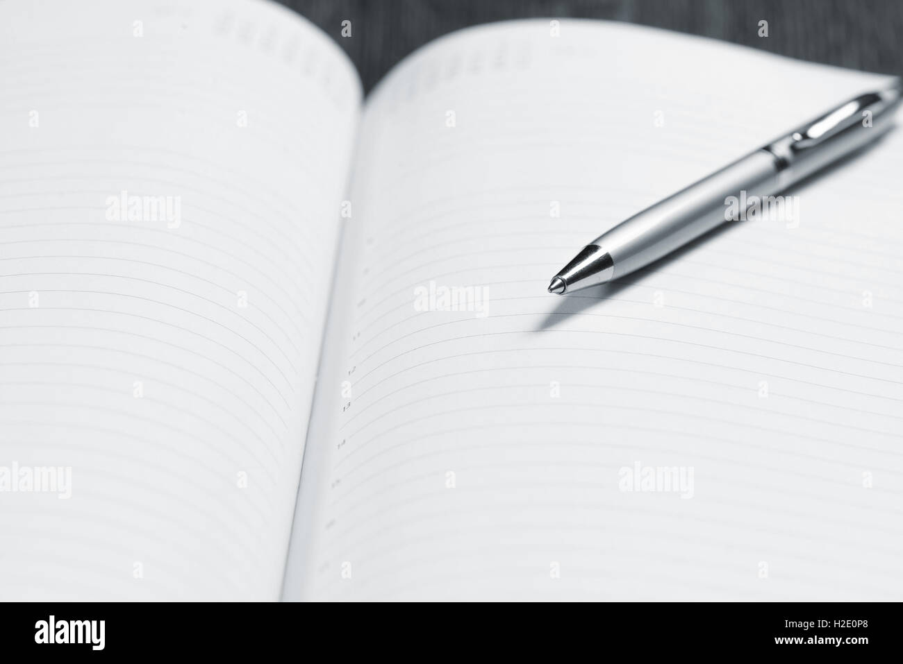 pen and open notepad Stock Photo - Alamy