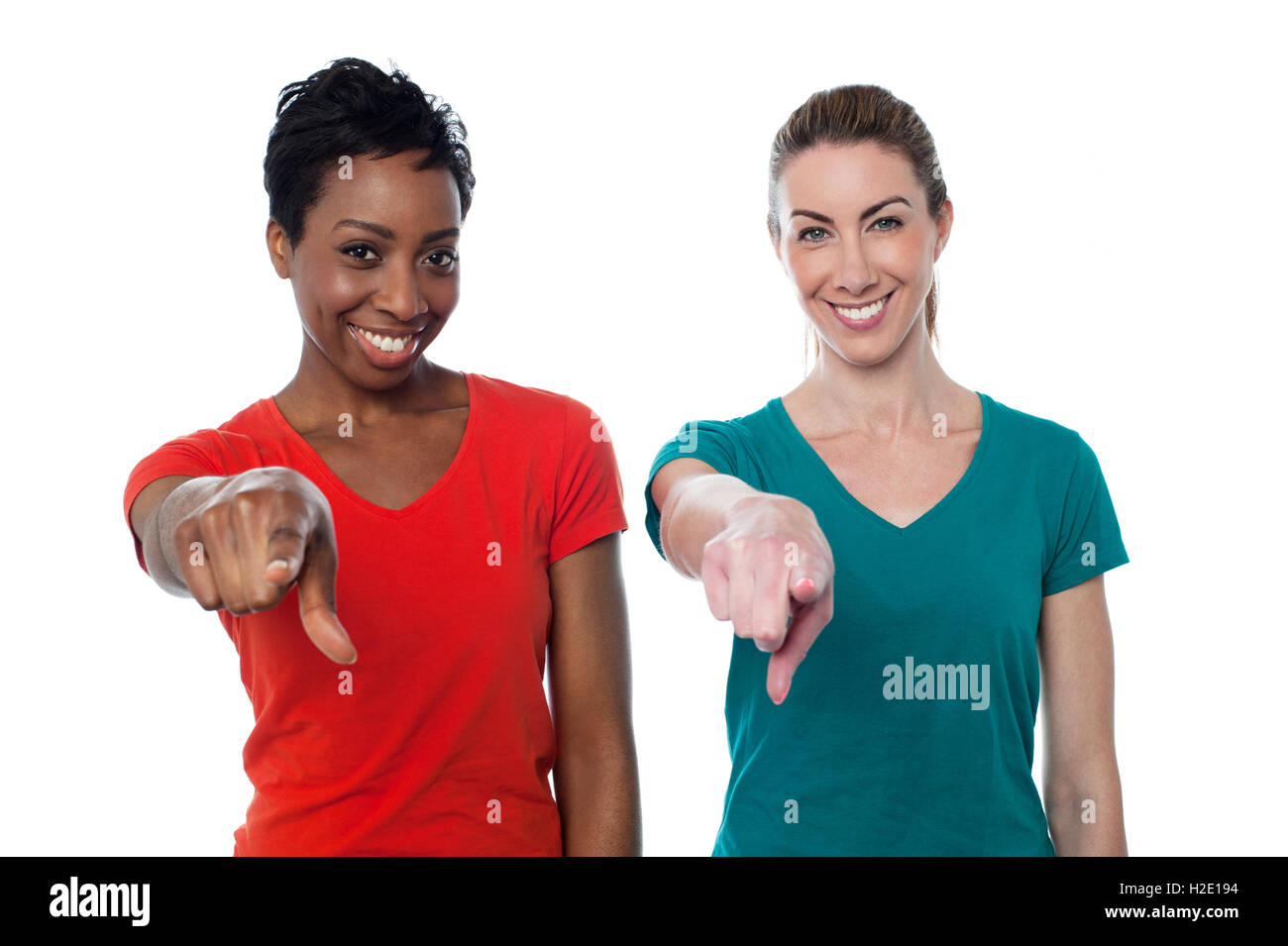 Smiling friends pointing to you Stock Photo - Alamy