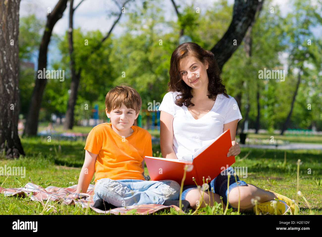 reading a book together Stock Photo - Alamy