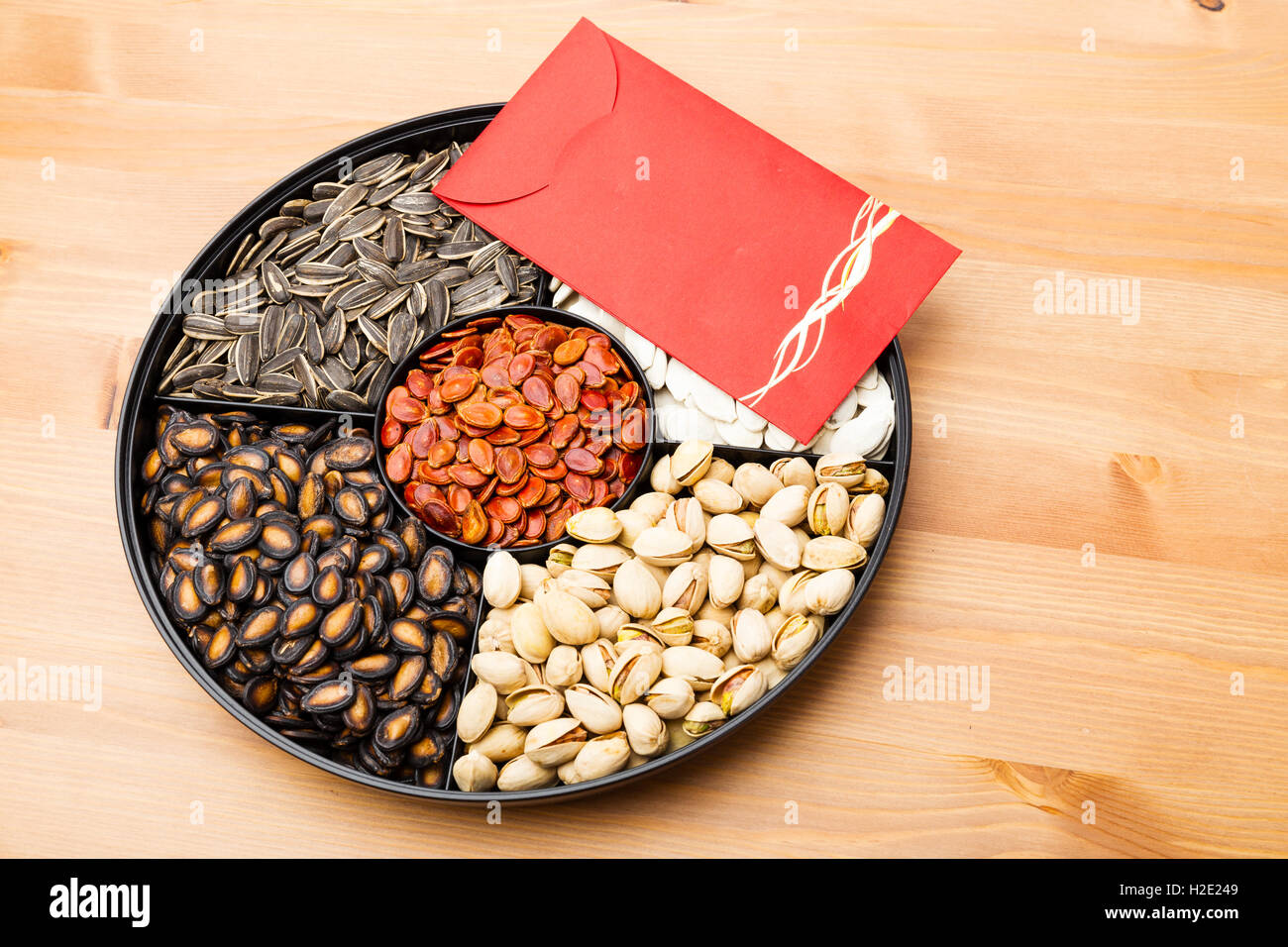 Assorted Chinese snack tray and red pocket for lunar new year Stock ...