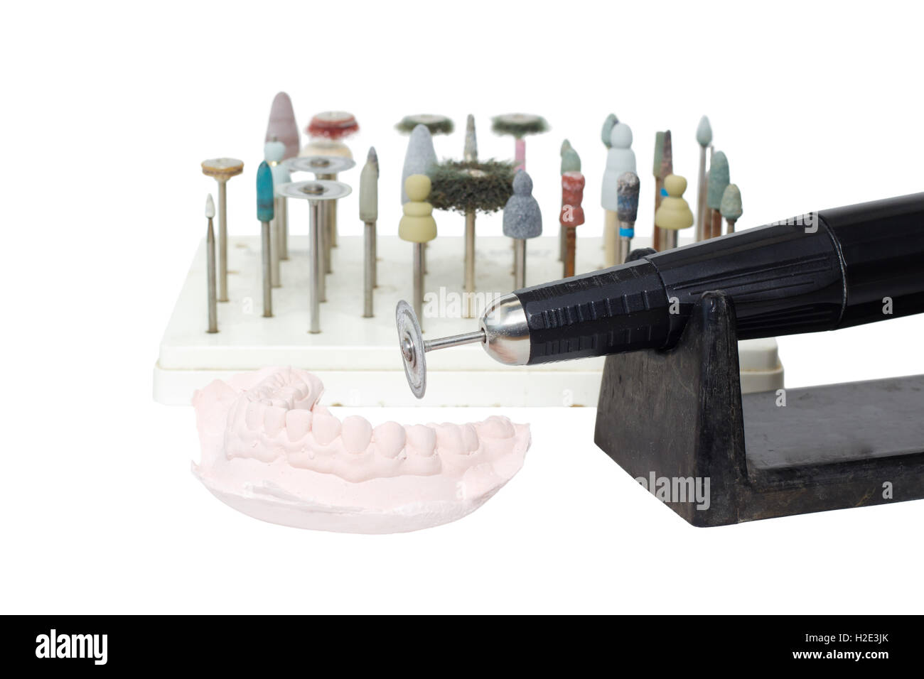 Old grunge micromotor dental lab with set of dental burs and grinding ...