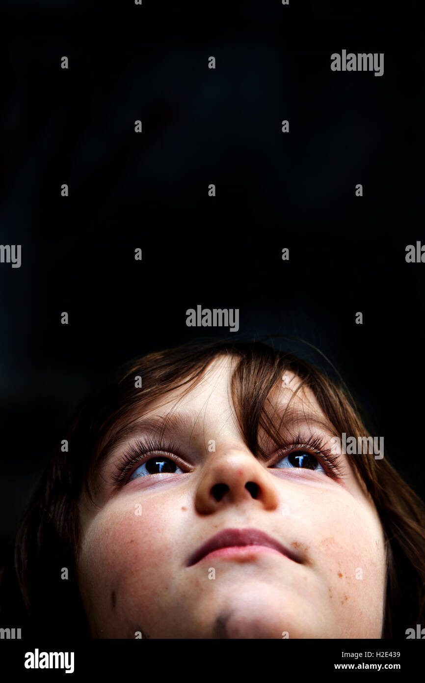 Boy looking up at the sky Stock Photo - Alamy