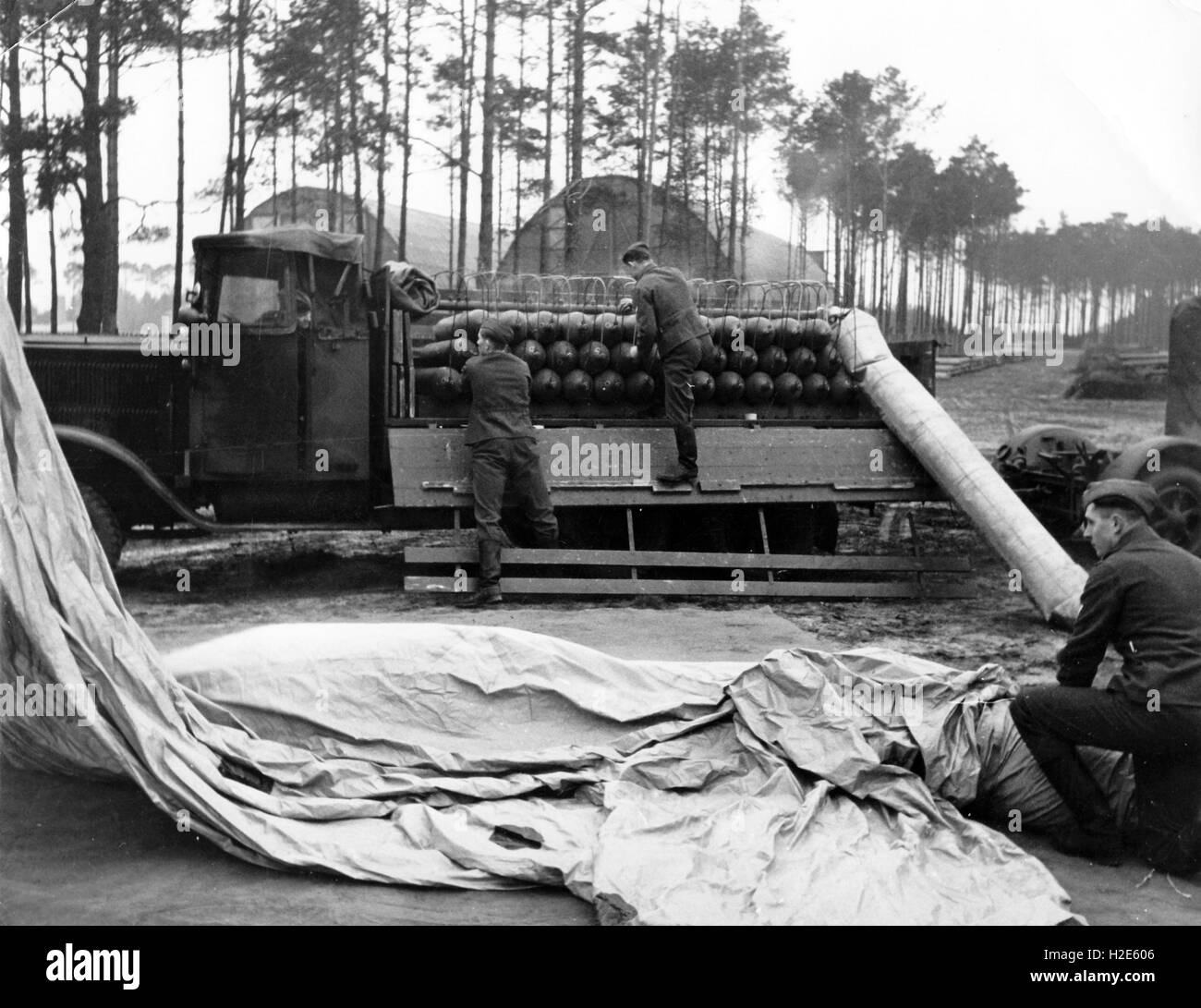 The Nazi propaganda image depicts soldiers of the German Wehrmacht at a ...