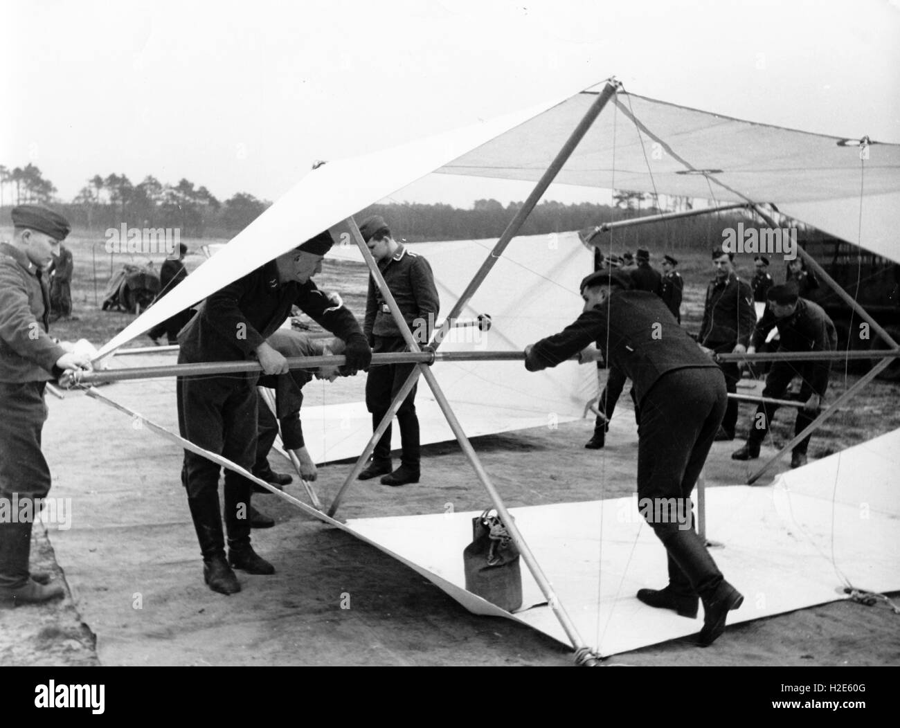 The Nazi propaganda image depicts soldiers of the German Wehrmacht at a ...