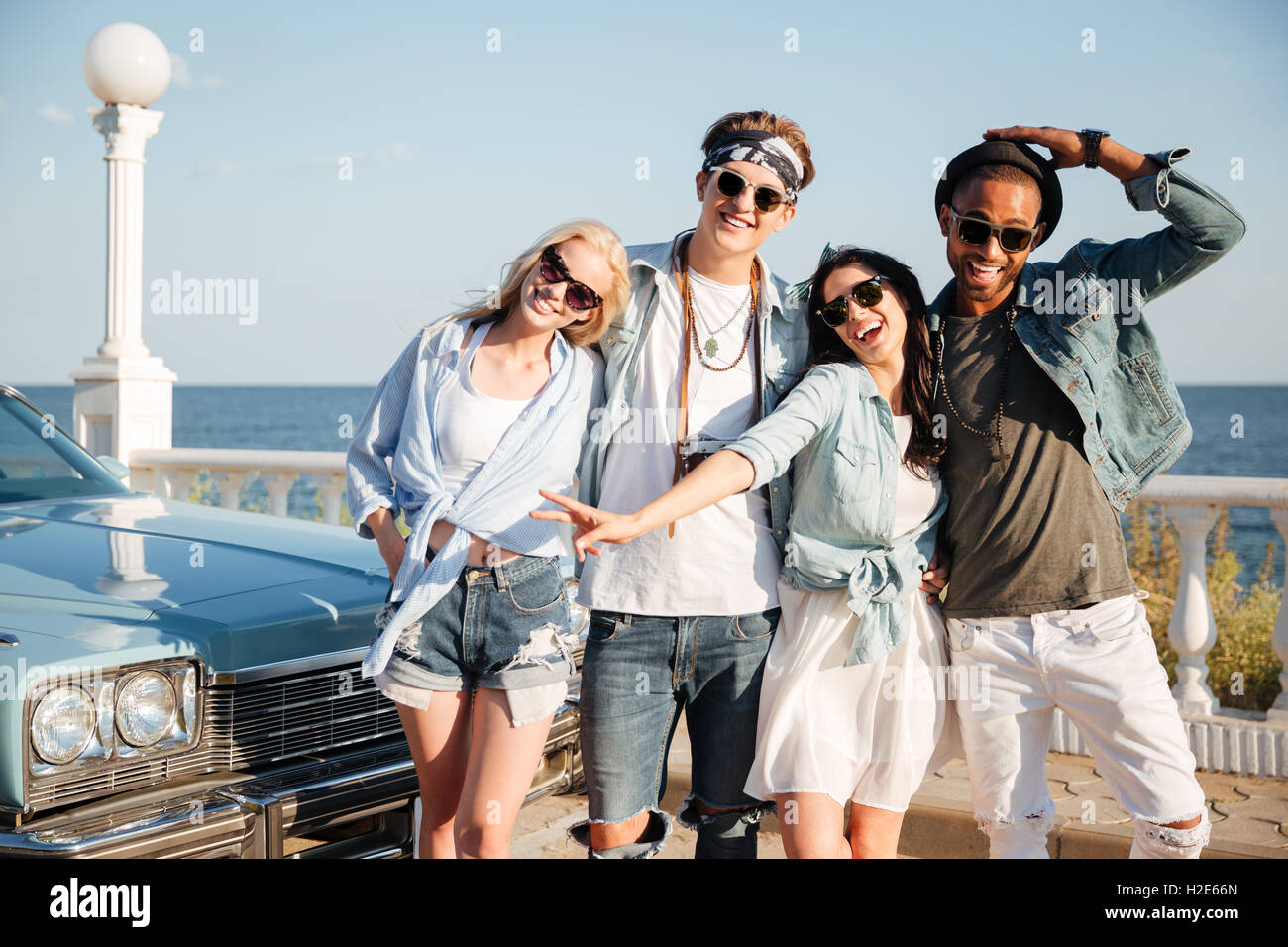 Group of happy young people standing and smiling on promenade Stock ...