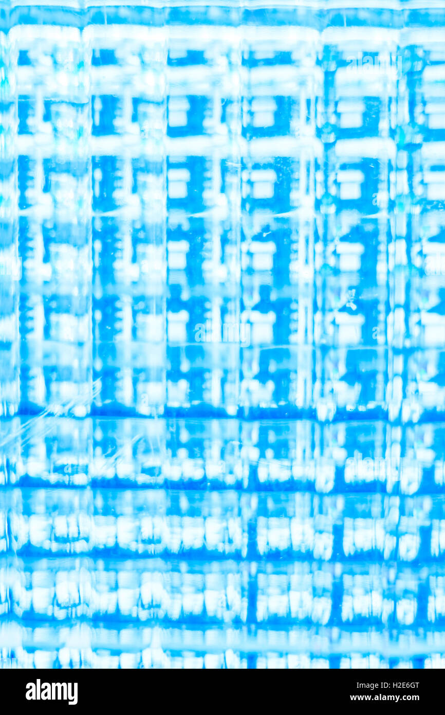 Blurred photo of blue glass block, abstract background Stock Photo - Alamy