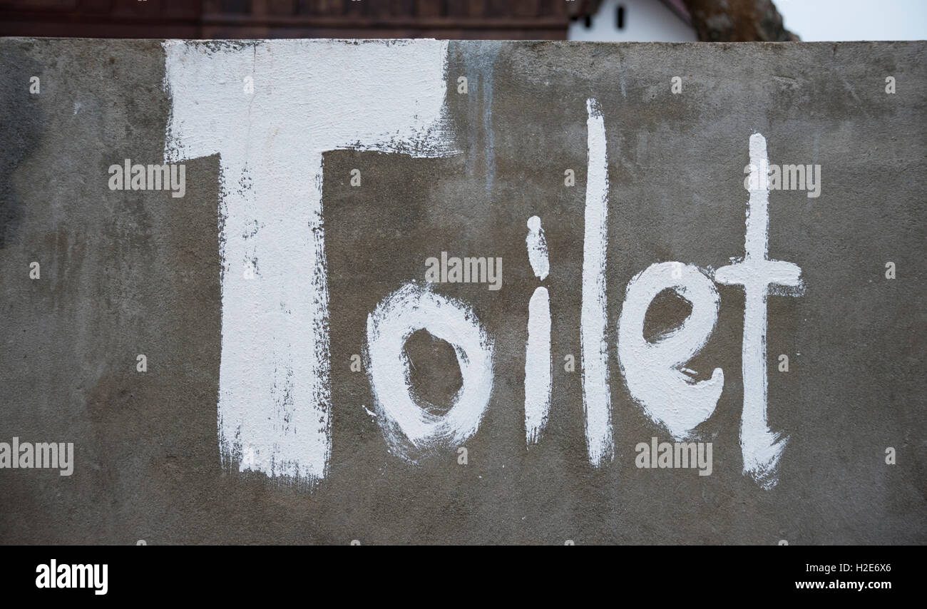 Toilet sign written on wall hi-res stock photography and images - Alamy