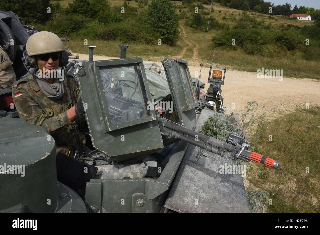German female tank soldier during the multinational exercise Combined ...
