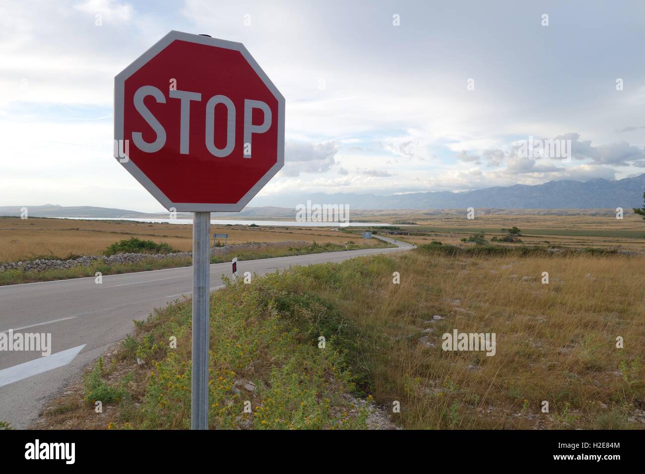 A stop sign on a country road on the island of Pag | usage worldwide ...