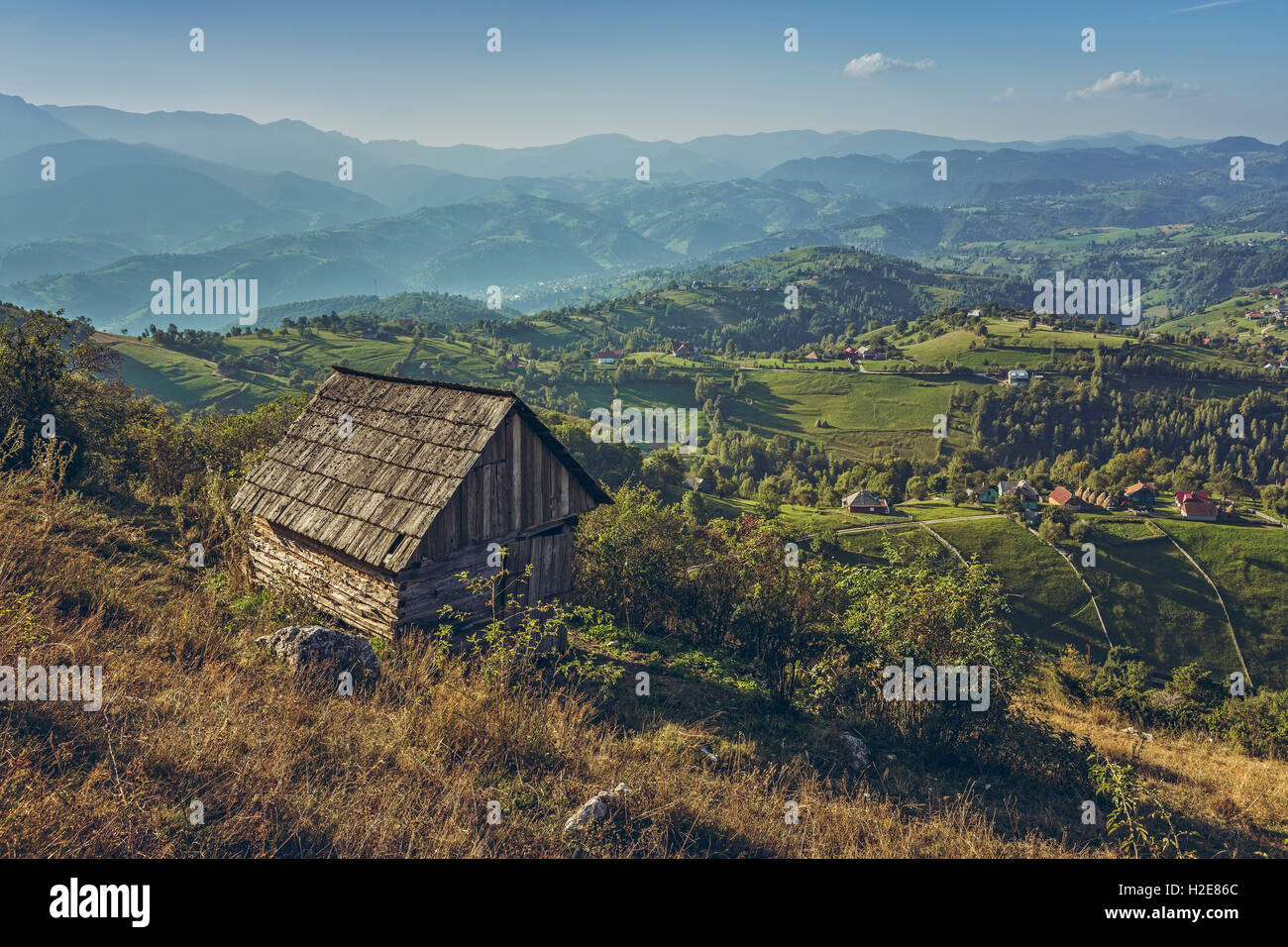 Idyllic rural scenery with old Romanian wooden barn in Magura village ...