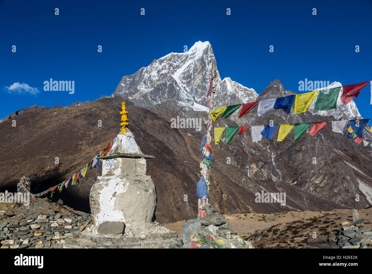 A tibetan buddhist stupa above the village of Dingboche (4800m) on the ...