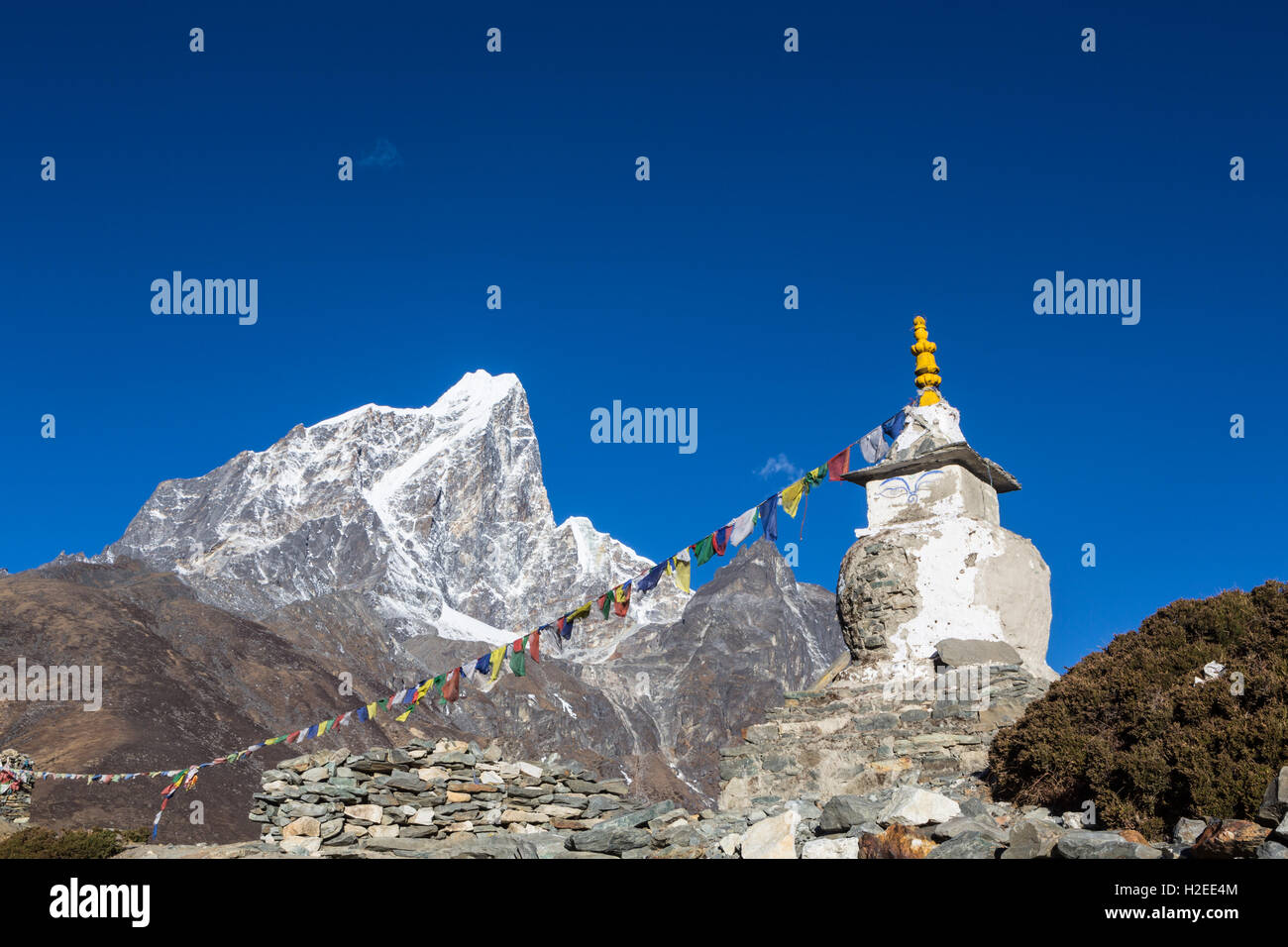 A tibetan buddhist stupa above the village of Dingboche (4800m) on the ...