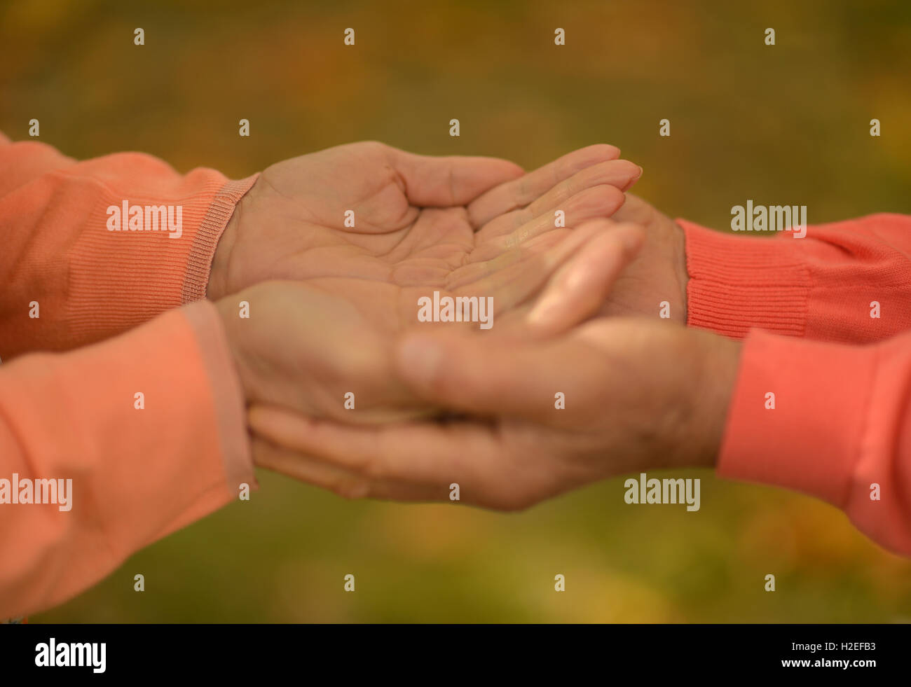Couple of hands together Stock Photo - Alamy