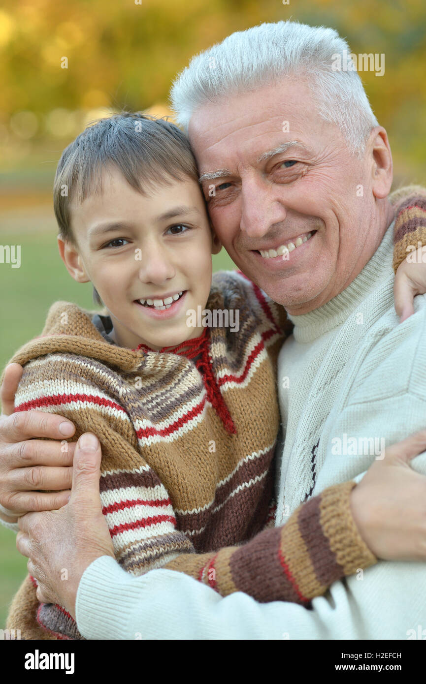 Grandfather and grandson in park Stock Photo - Alamy