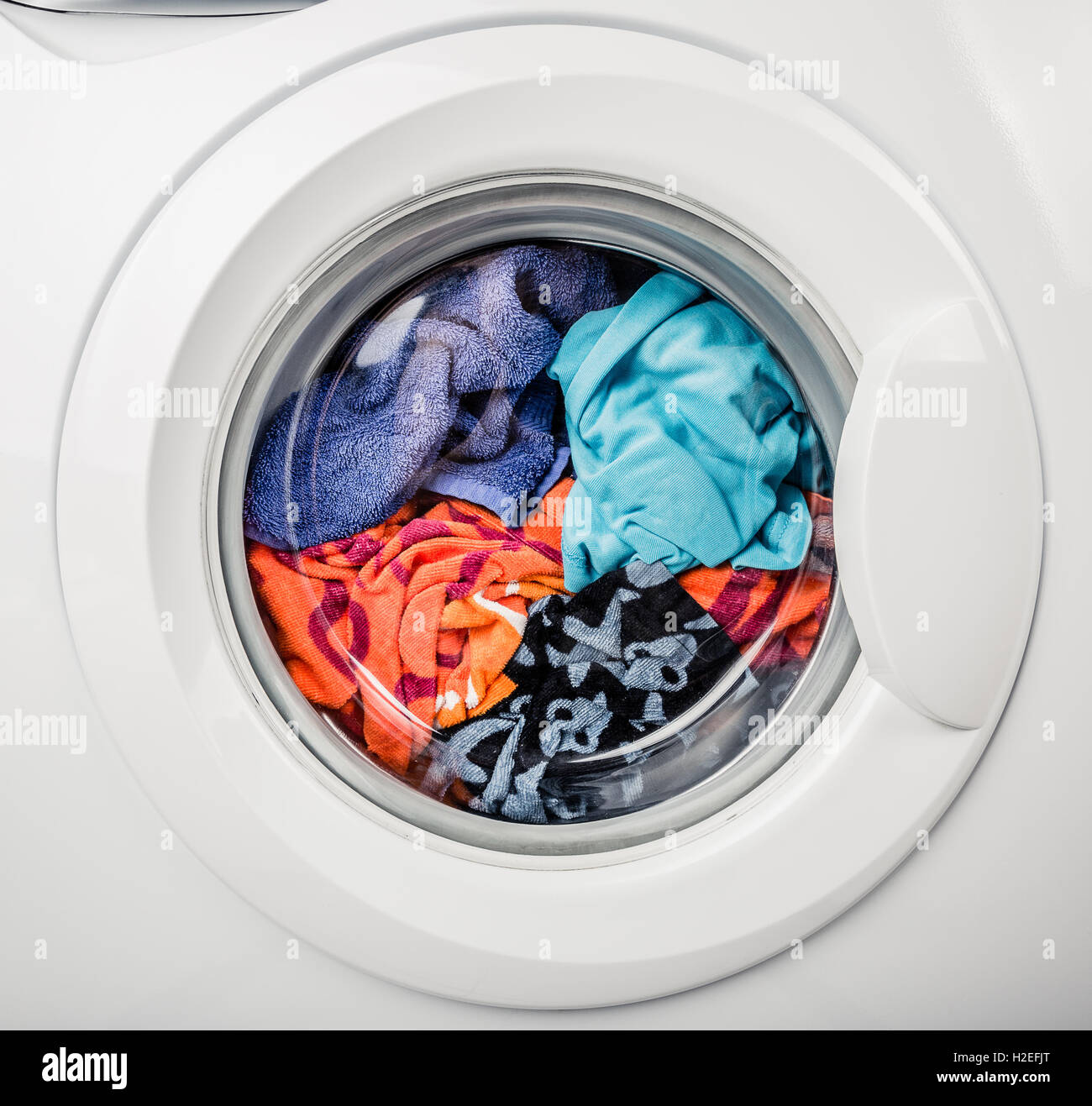 Washing machine with color clothes Stock Photo - Alamy