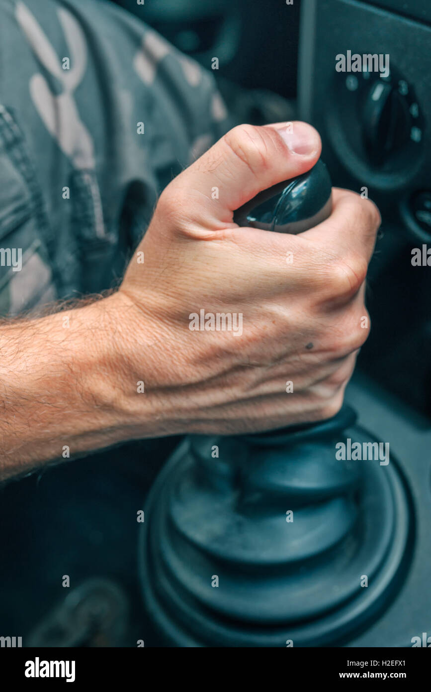 Male driver hand shifting gear manually, selective focus Stock Photo ...