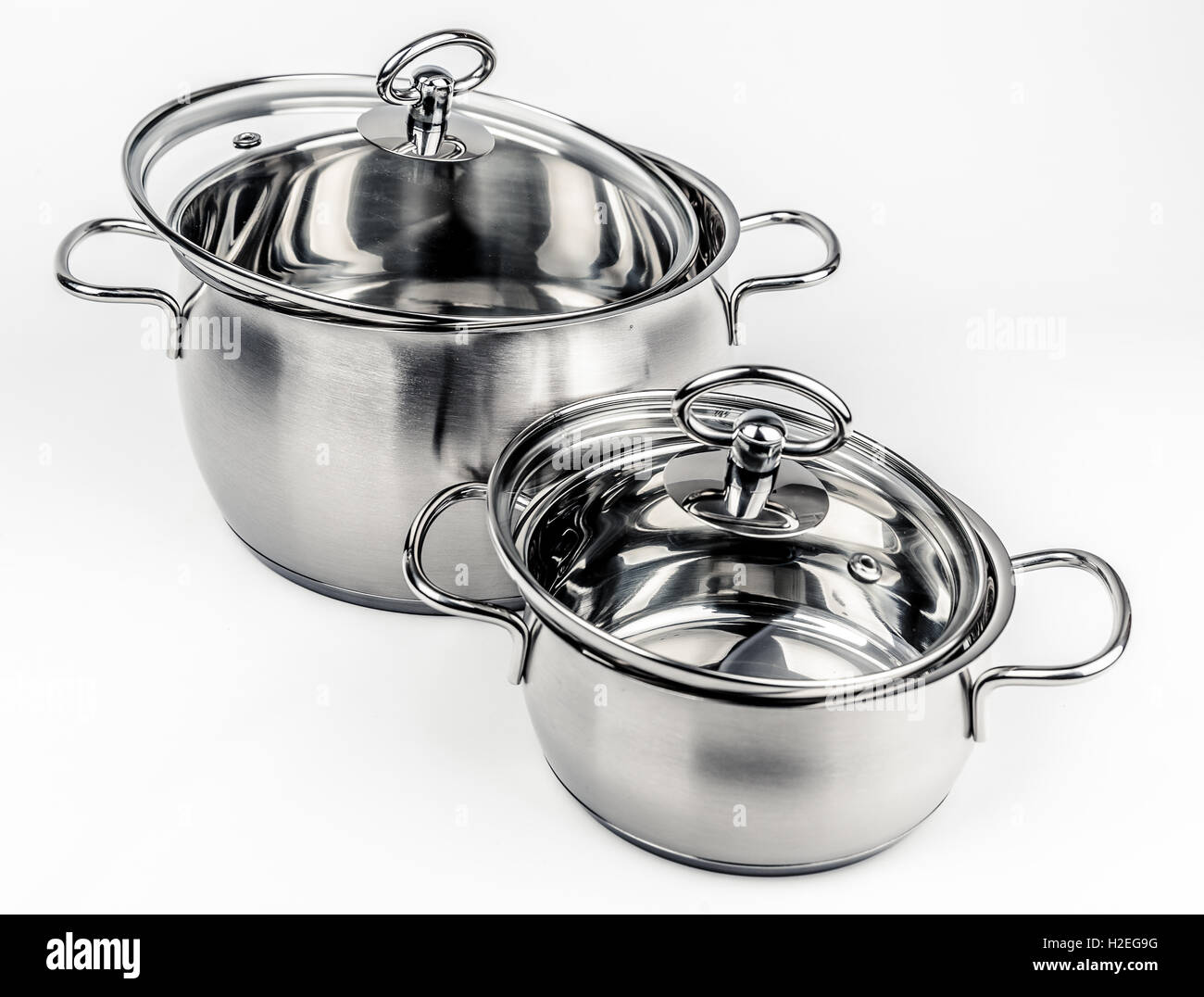 Two Metal stock pots with glass lid Stock Photo - Alamy