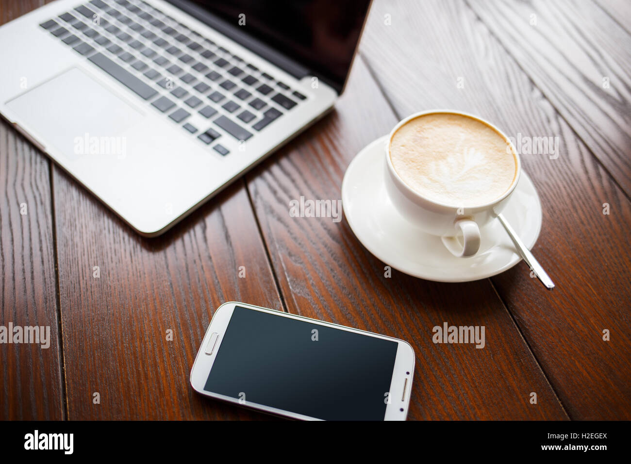 Mockup image with laptop, coffee and phone in cafe. Coffee break ...