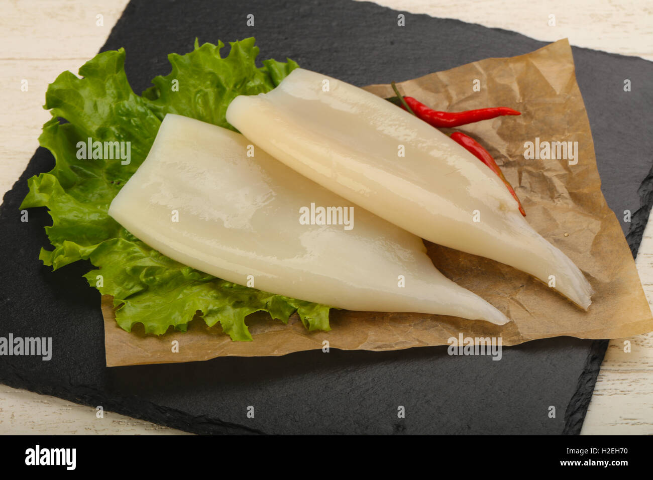 Raw squid fillet ready for cooking Stock Photo - Alamy