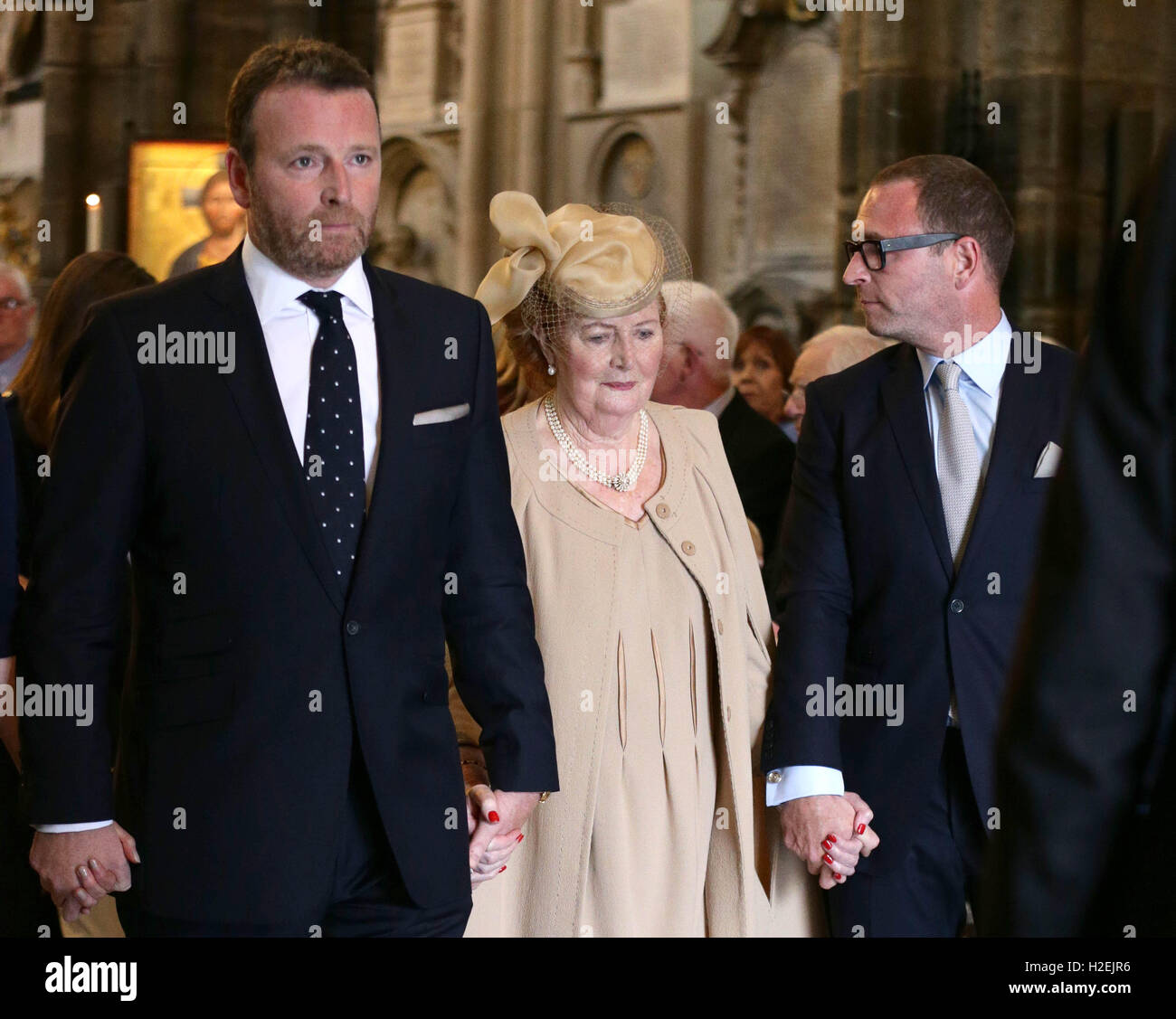 Helen Wogan the widow of Sir Terry Wogan, walks with their sons Alan ...