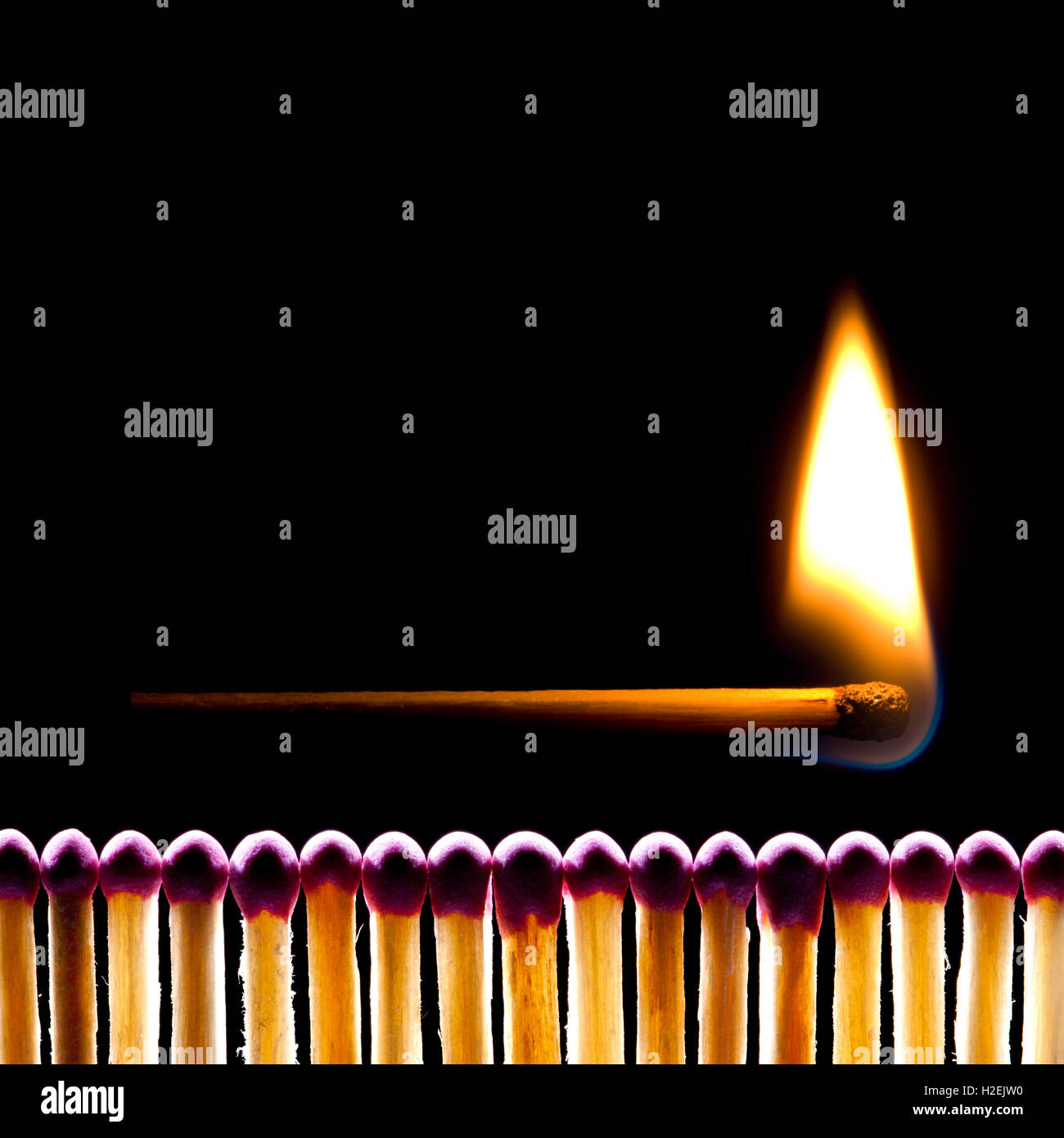 It is a lot of matches on a black background. One match burns. Black ...