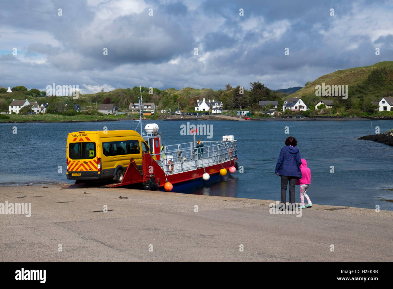 School bus using the luing ferry hi-res stock photography and images ...