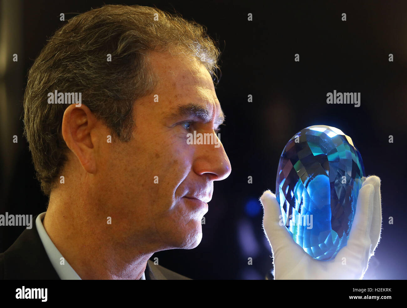 Maurice Ostro from Ostro Minerals holds the world's largest topaz, a ...