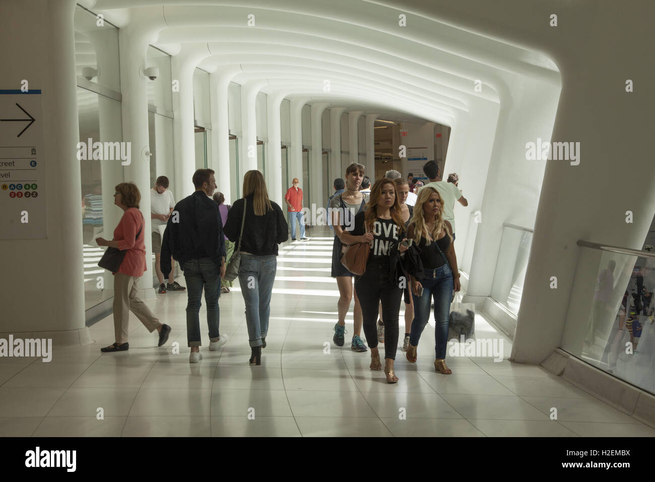 Visitors and shoppers in the Oculus Mall at the World Trade Center walk ...