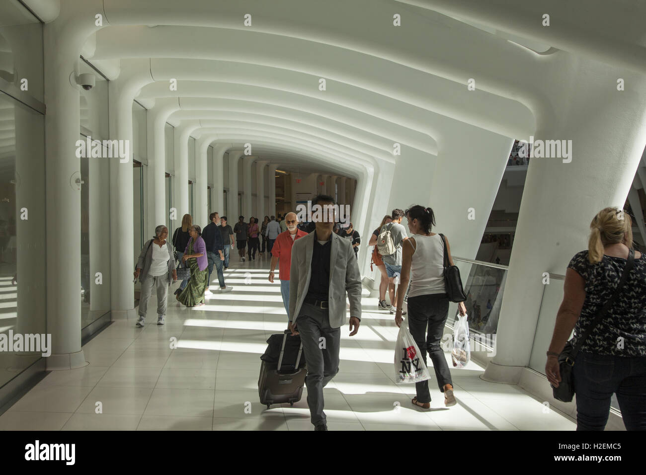 Visitors and shoppers in the Oculus Mall at the World Trade Center walk ...