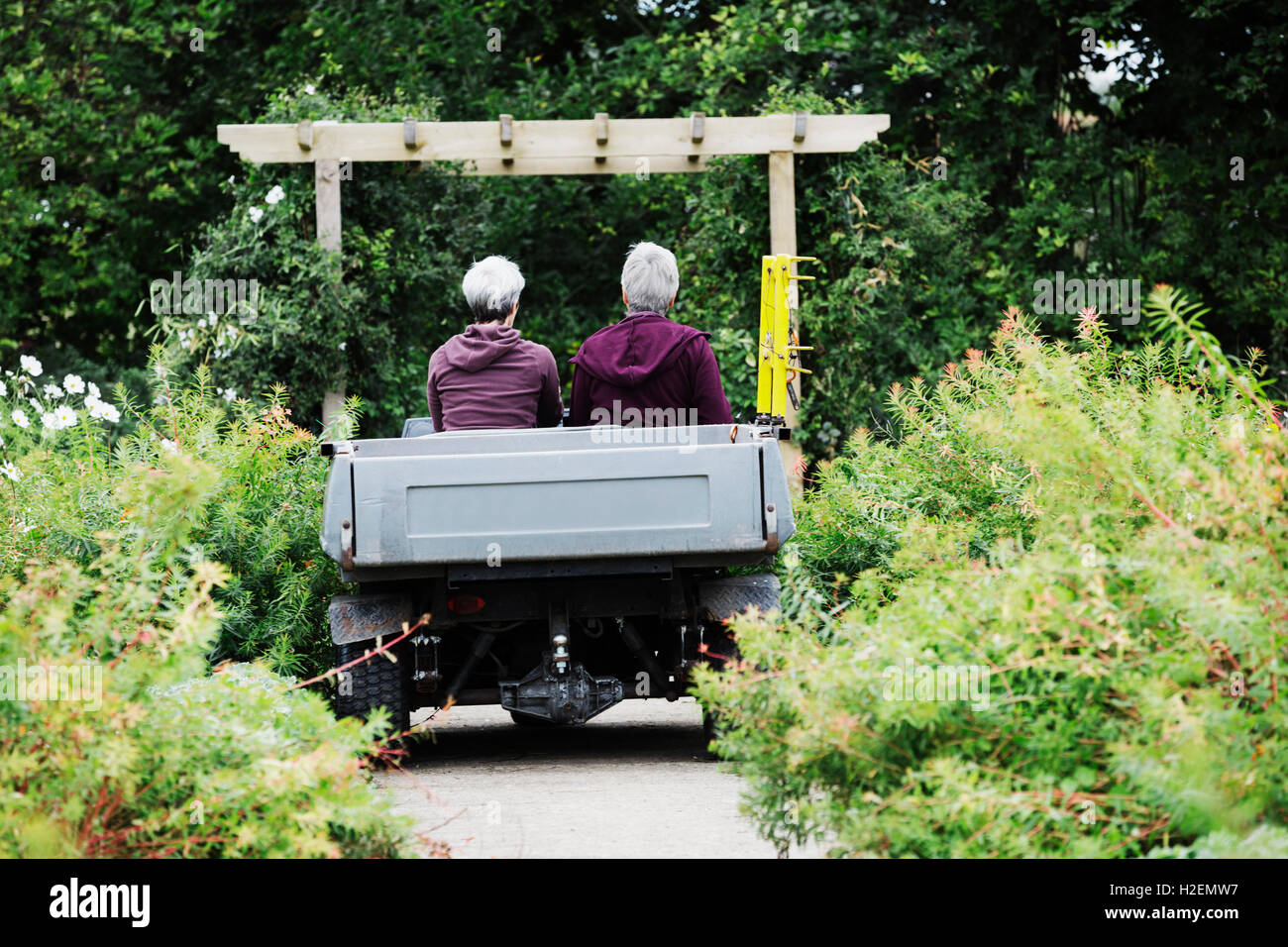 2 people riding on a tractor hi-res stock photography and images - Alamy