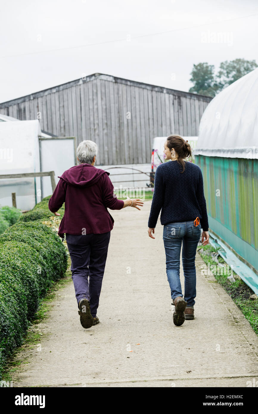 Two Women Walking Down Path High Resolution Stock Photography and ...