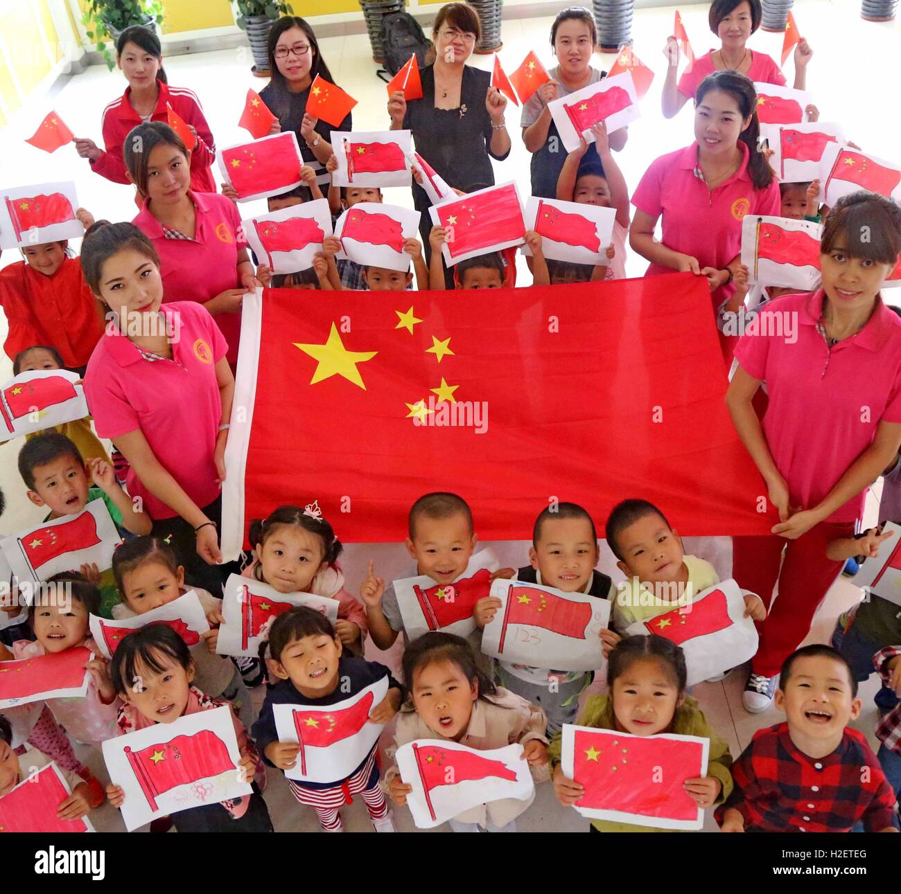 Qinhuangdao, China. 27th Sep, 2016. Kids show their paintings of the ...
