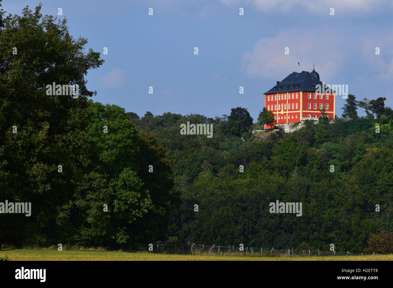 The red colour on the front of Brandenstein Castle gleams in the sun ...
