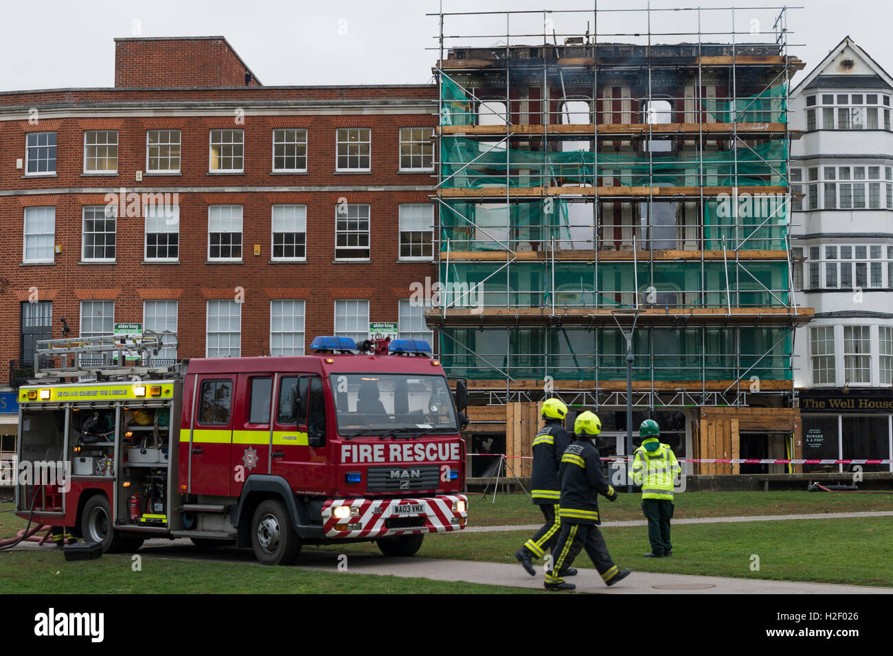 Firefighters damp-down a blaze which gutted the Castle Art Gallery ...