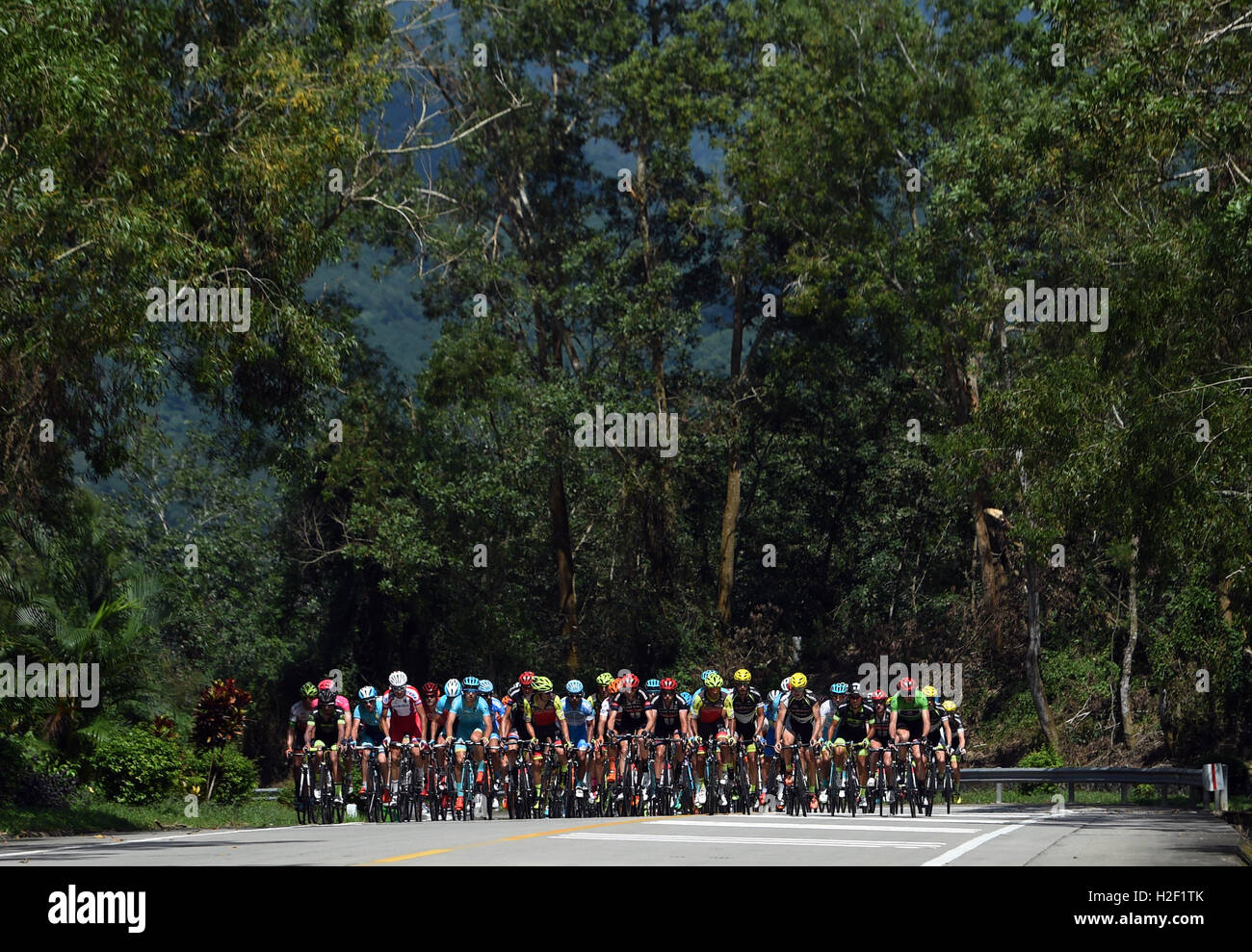 Sanya, China's Hainan Province. 28th Oct, 2016. Cyclists compete during ...