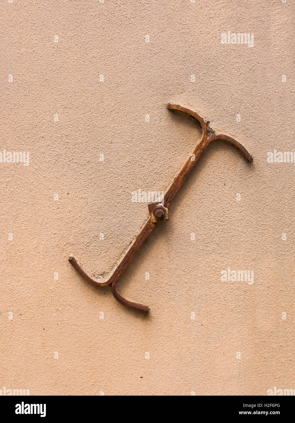 anchor plate or wall washer on a plastered wall of a medieval house ...