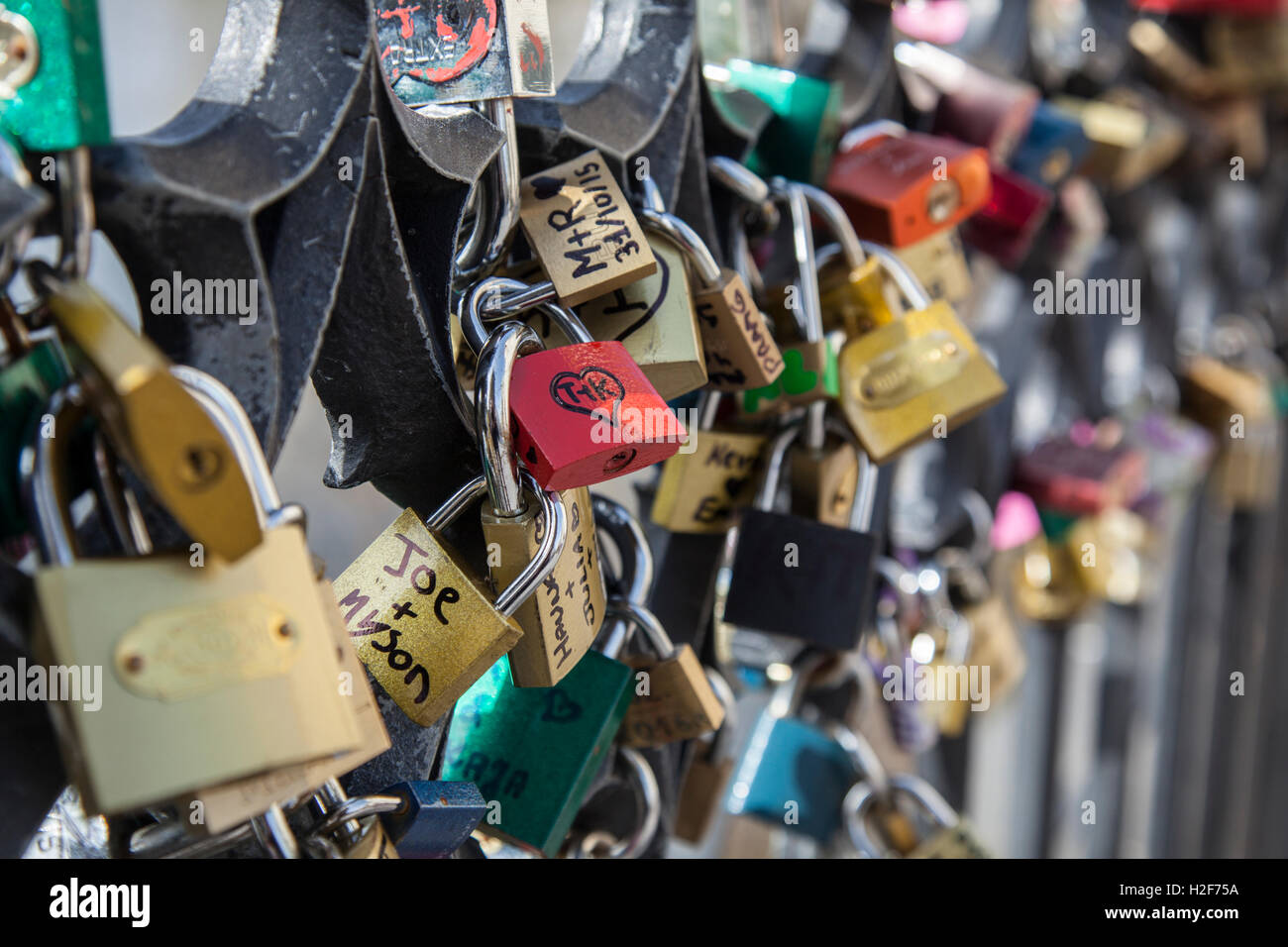 Love locks on railings next to Charles Bridge Prague Stock Photo - Alamy