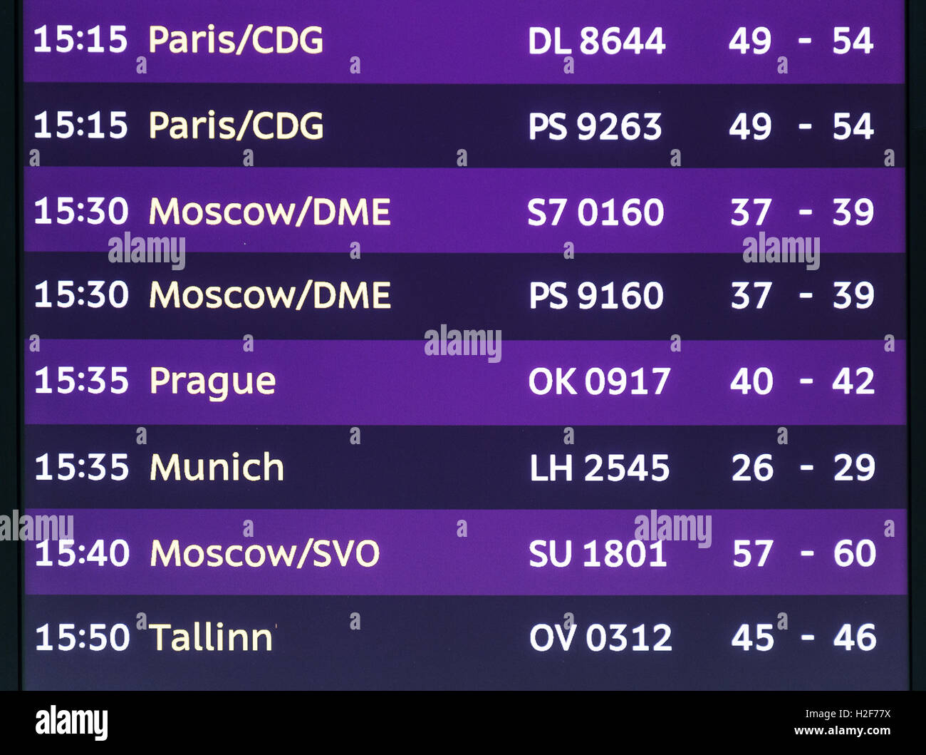 International arrivals board panel Stock Photo - Alamy