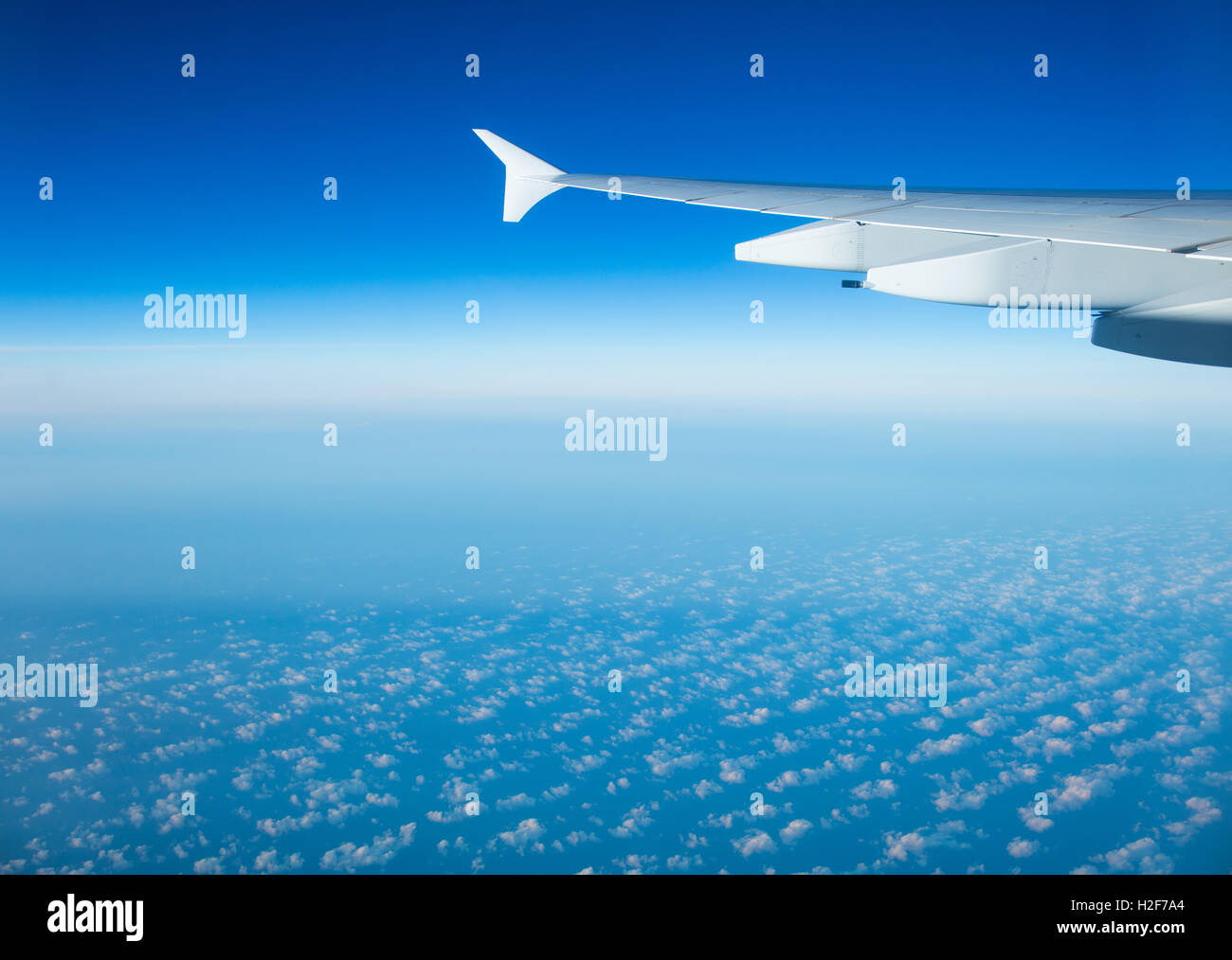 Beautiful view above clouds from airplane perspective with wing Stock ...