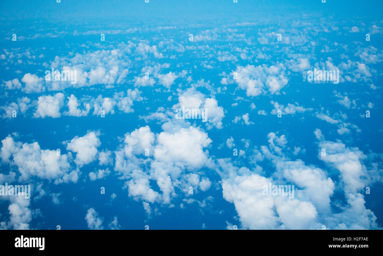 Beautiful view above clouds from airplane perspective Stock Photo - Alamy