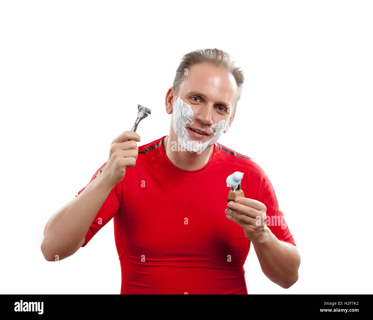 Man has a shave with the razor Stock Photo - Alamy