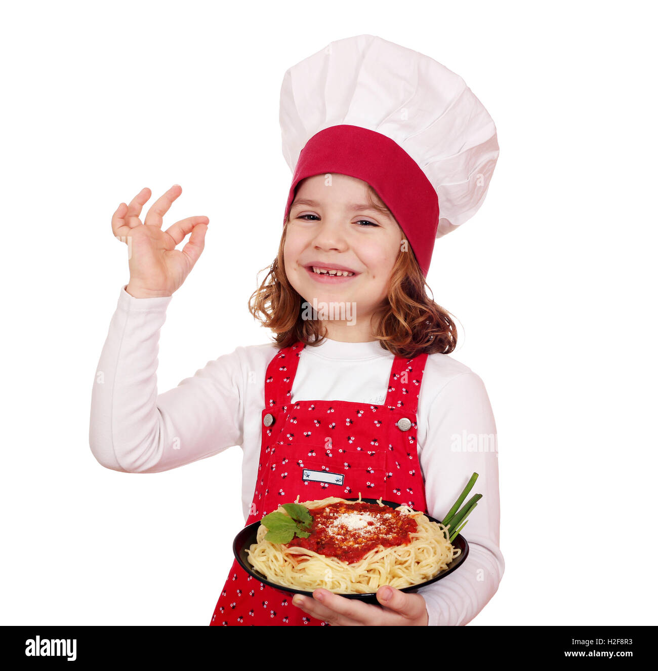 happy little girl cook with spaghetti Stock Photo - Alamy