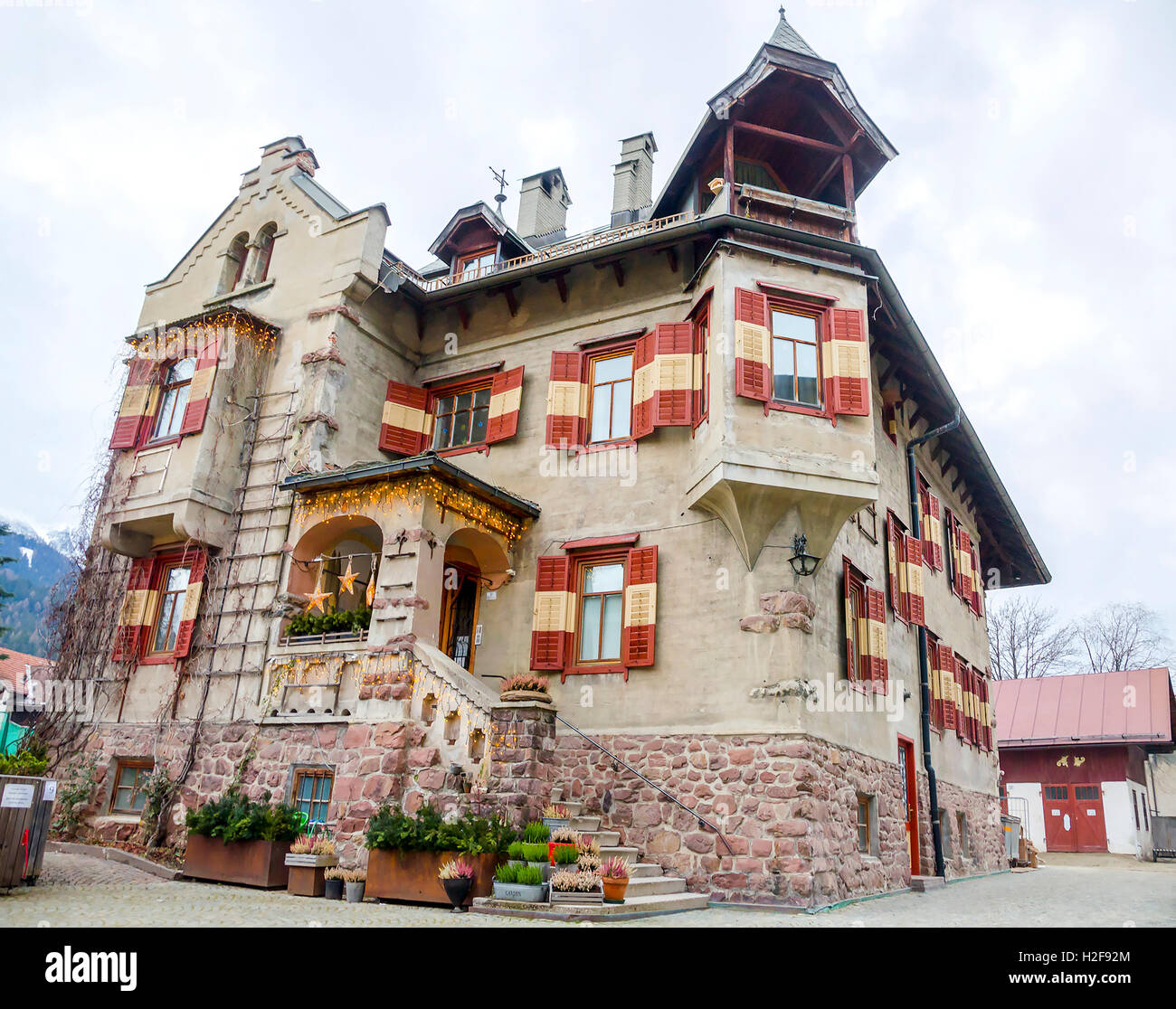 Brunico, Italy, 14 December 2014: a strange and imposing big house with ...