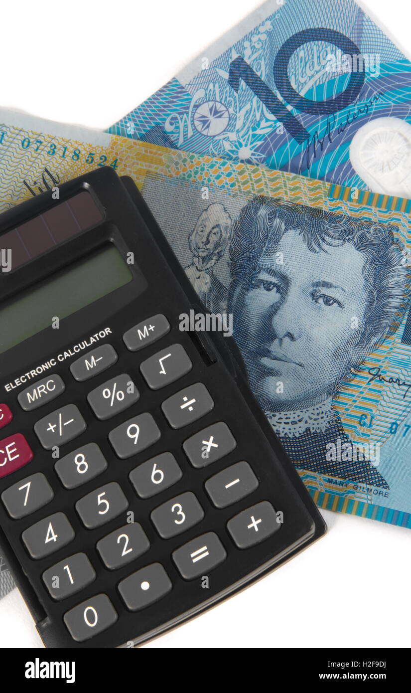 australian cash and calculator over white Stock Photo - Alamy