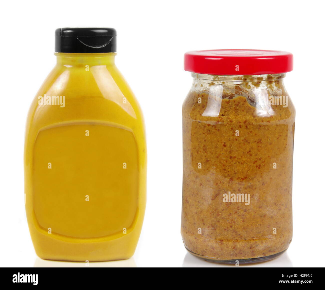 two style mustards over white surface Stock Photo - Alamy
