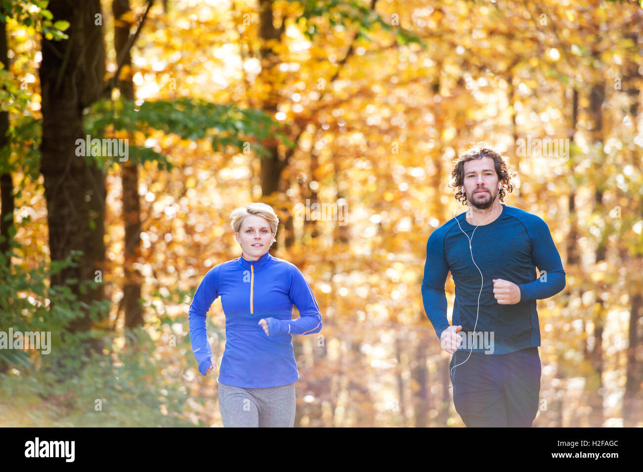Runner woman running sunny path hi-res stock photography and images - Alamy