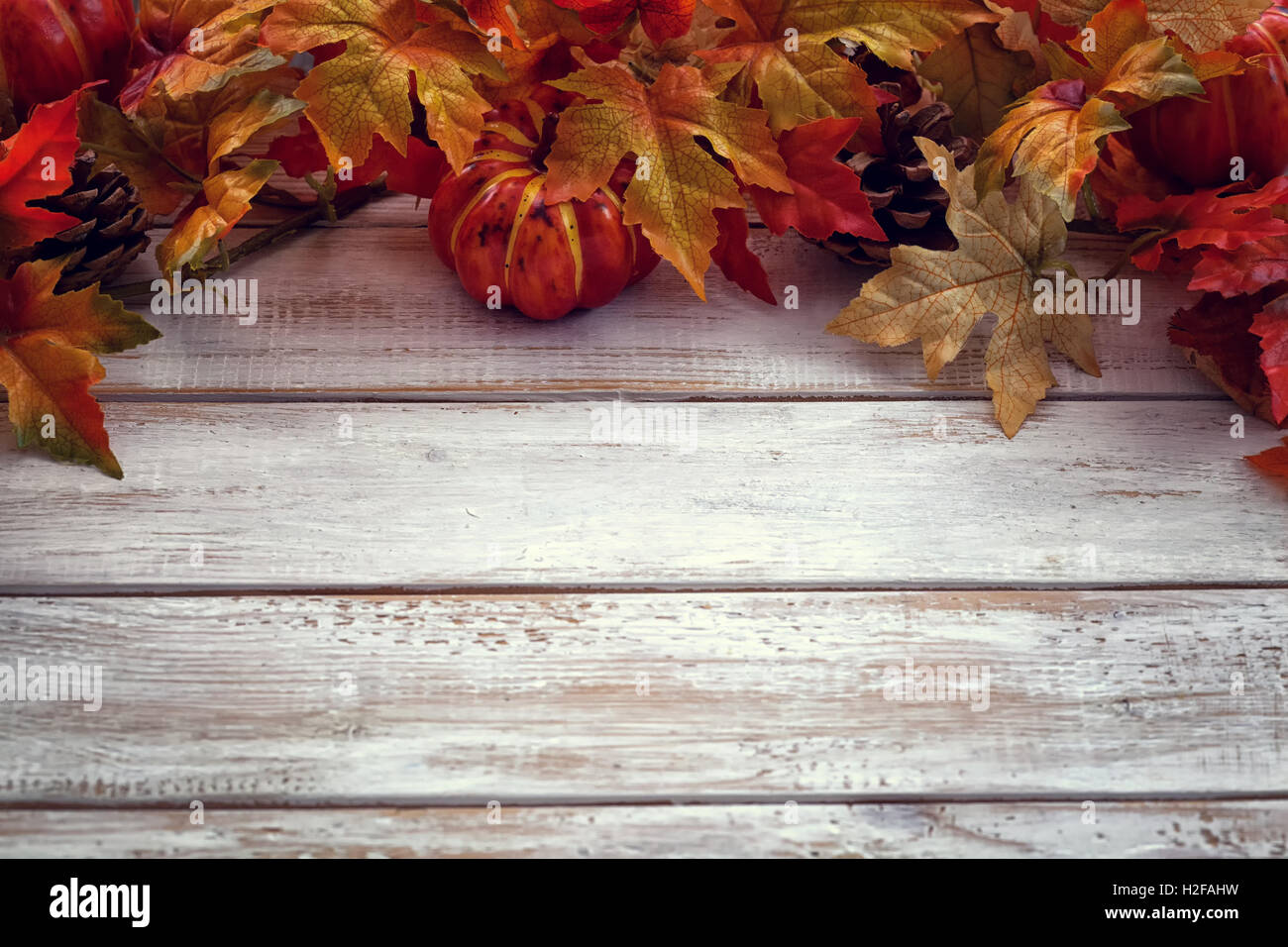 Autumn background with colored leaves on white wooden board Stock Photo ...