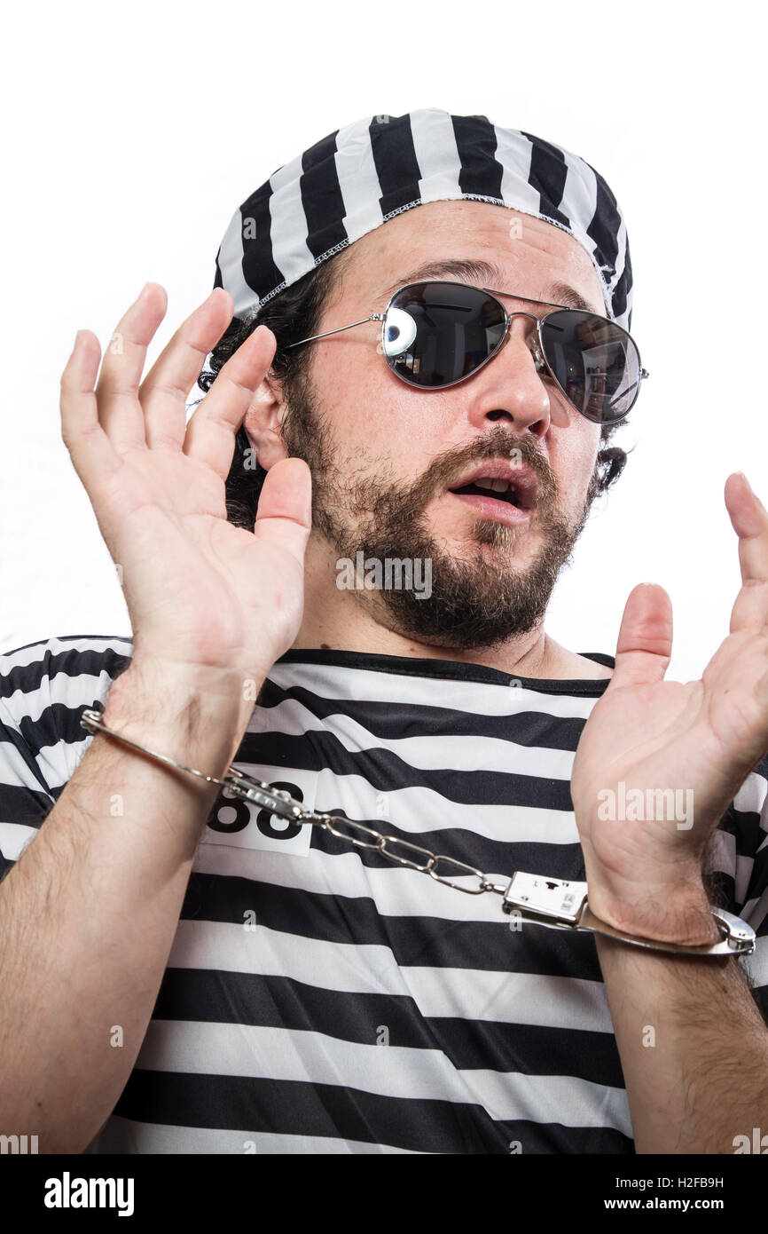 Locked, Desperate, portrait of a man prisoner in prison garb, ov Stock ...